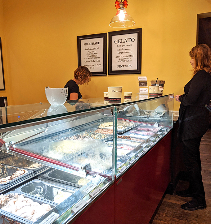 The gelato case – where adults press their noses against glass with the same wonder children reserve for toy stores.