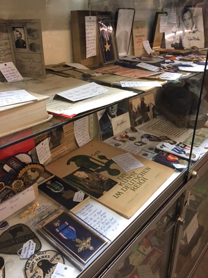 History preserved under glass—medals and memories from conflicts that shaped our world, reminding us of sacrifices made.