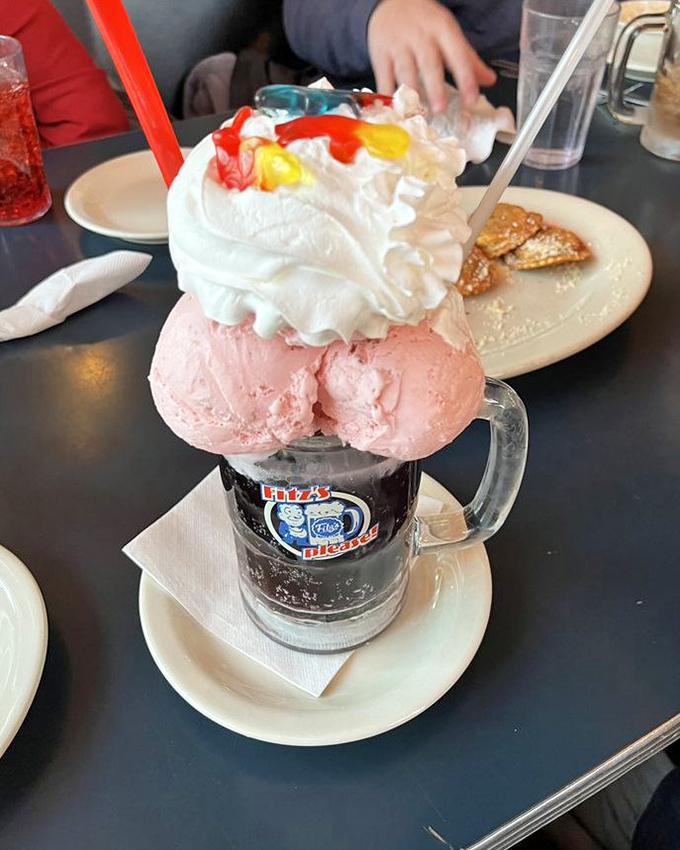 The Grape Escape float isn't just dessert, it's performance art—a tower of pink ice cream and whipped cream that demands to be photographed before devoured.