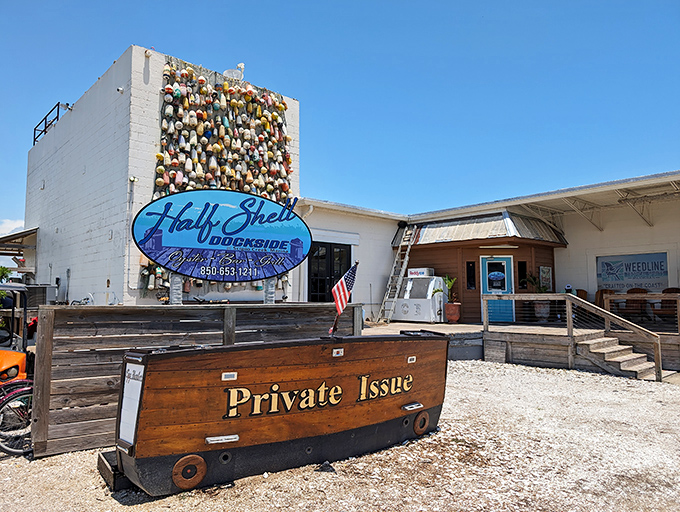 Half Shell Dockside's wall of buoys tells stories of countless fishing expeditions—each colorful float a chapter in Apalachicola's maritime novel.