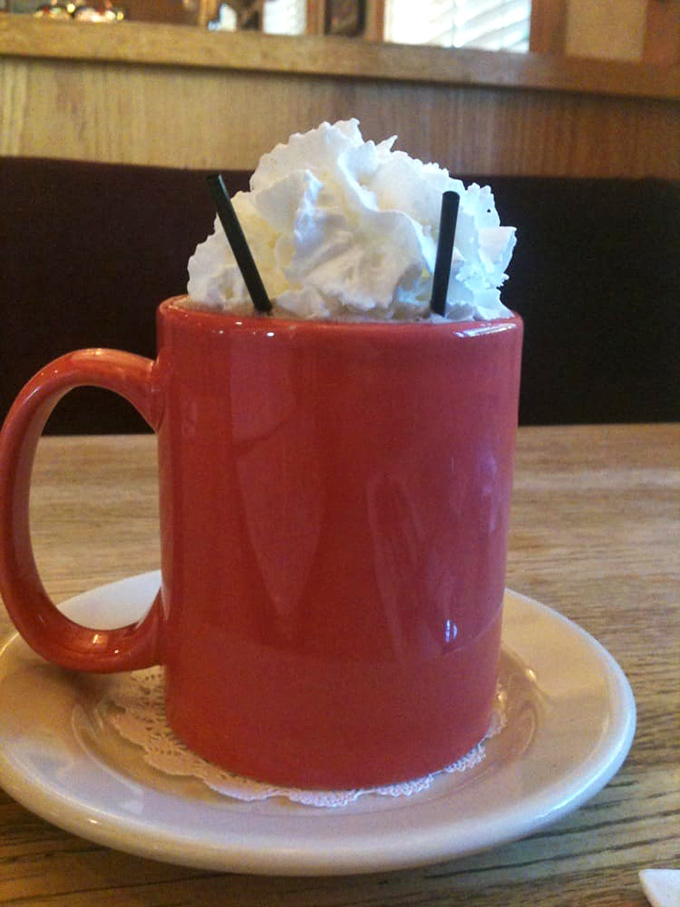 Hot chocolate that doesn't just come with whipped cream—it comes with a whipped cream skyscraper. Sipping optional, face-planting inevitable.