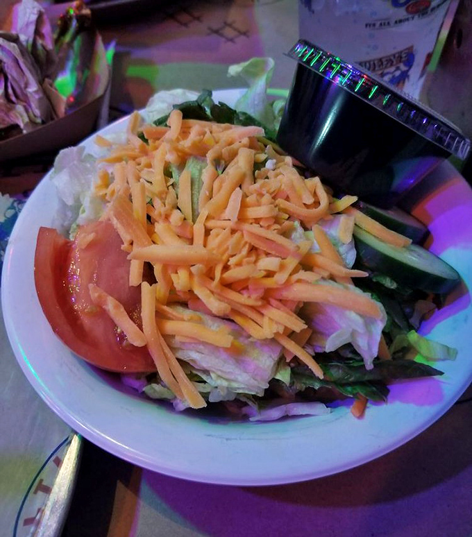 Even the house salad looks like it's trying to compete with those famous burgers for attention.