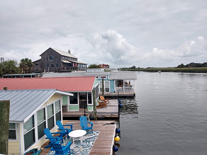 Colorful houseboats with inviting decks showcase a lifestyle where your front porch is always waterfront and happy hour views are included.