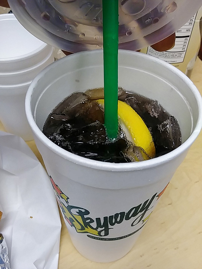 The perfect companion to any burger feast – a Skyway sweet tea with lemon, where the condensation on the cup is practically Midwestern poetry.
