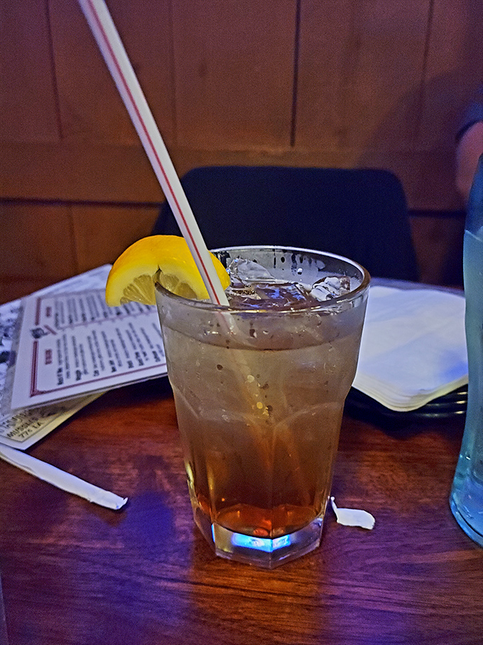 An iced tea garnished with lemon—because sometimes the classics don't need reinventing, just a comfortable chair to enjoy them in.