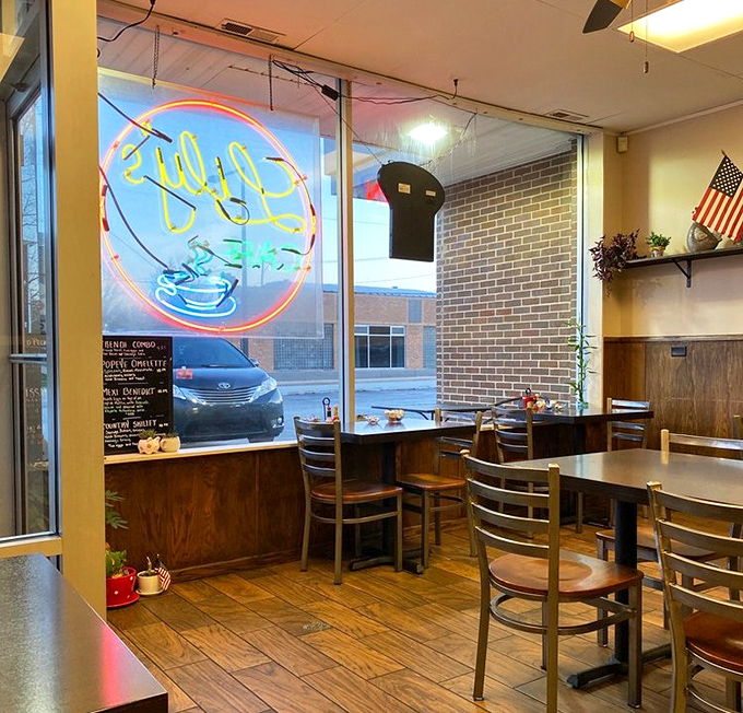 The neon sign in the window promises coffee, but the tables inside promise community. Morning light streams in, illuminating possibilities for the day ahead.