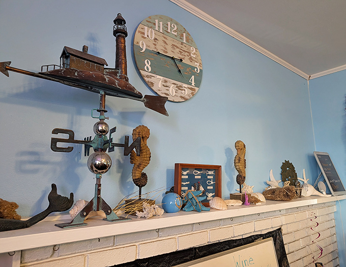 Coastal kitsch done right—a mantel adorned with the treasures of the sea, where every seahorse and lighthouse has earned its place.
