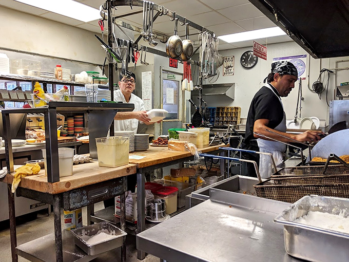 The kitchen—where the magic happens without smoke and mirrors. Just skilled hands, well-seasoned equipment, and recipes that have stood the test of time.