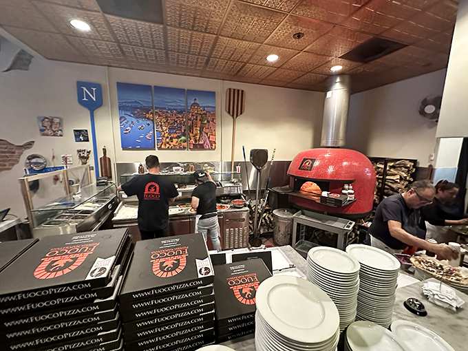 The fiery red oven isn't just cooking pizzas—it's performing time travel to Naples. Those aren't pizzaiolos, they're culinary magicians.