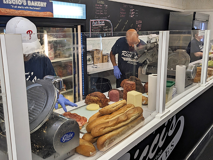 Behind the counter, where sandwich artisans transform simple ingredients into legendary hoagies that haunt your dreams.