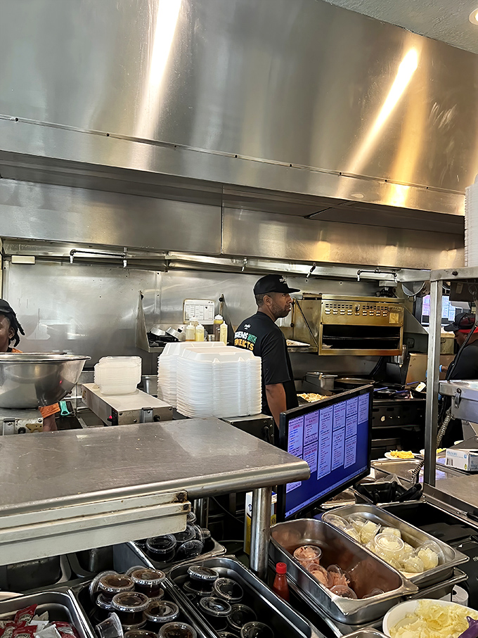 Kitchen choreography in action. The dance of short-order cooking is a beautiful thing to behold—especially when chicken and waffles are the end result.