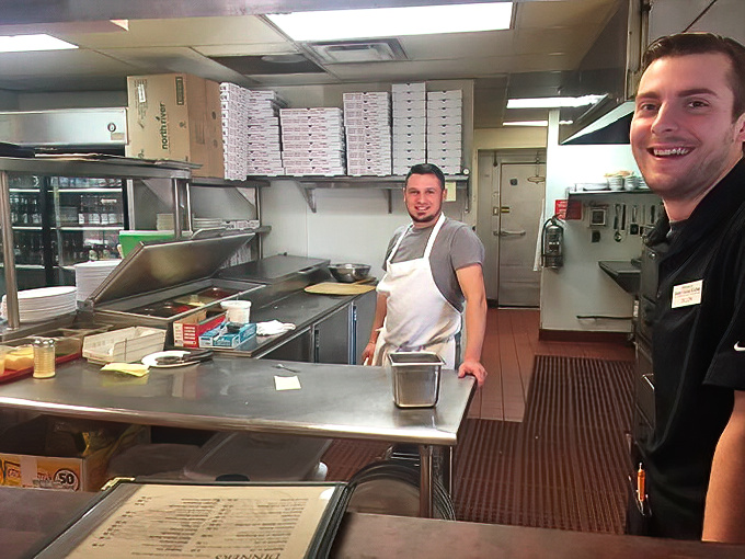 Where the magic happens—a glimpse into the engine room of flavor where staff members create edible memories with equal parts skill and genuine Ohio hospitality.