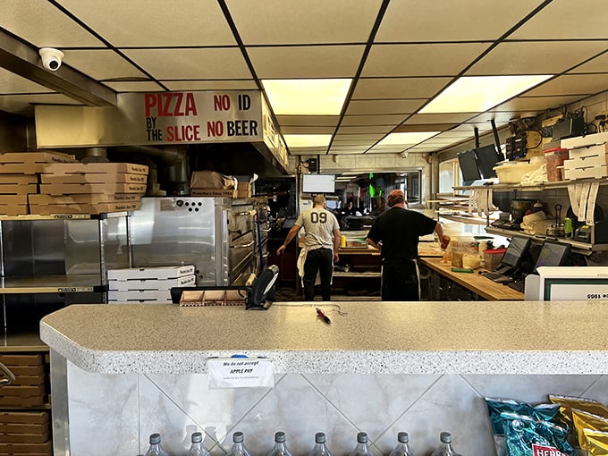Behind-the-scenes pizza magic! Where "No ID, No Slice, No Beer" isn't just a sign—it's a philosophy of life.