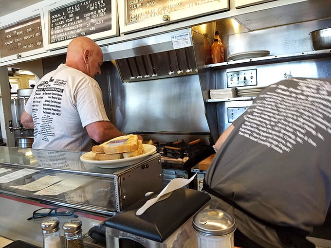 The short-order ballet continues behind the counter. No fancy culinary school techniques—just decades of muscle memory creating perfect breakfast rhythms.