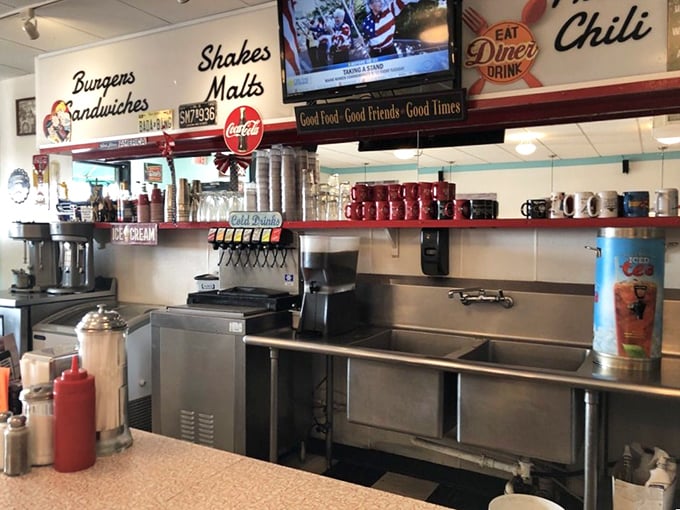 Behind the counter magic happens – where milkshakes are born, burgers are flipped, and the soda fountain stands ready to fulfill your fizzy dreams.