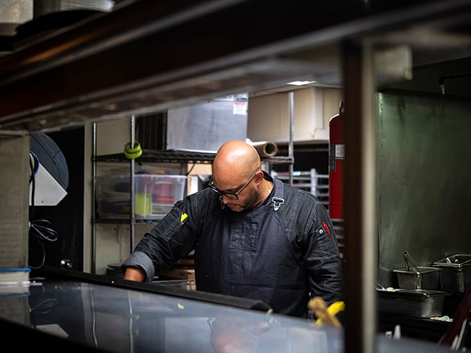 Where the magic happens – a glimpse into the kitchen where chefs transform ingredients into edible art with the focus of symphony conductors.