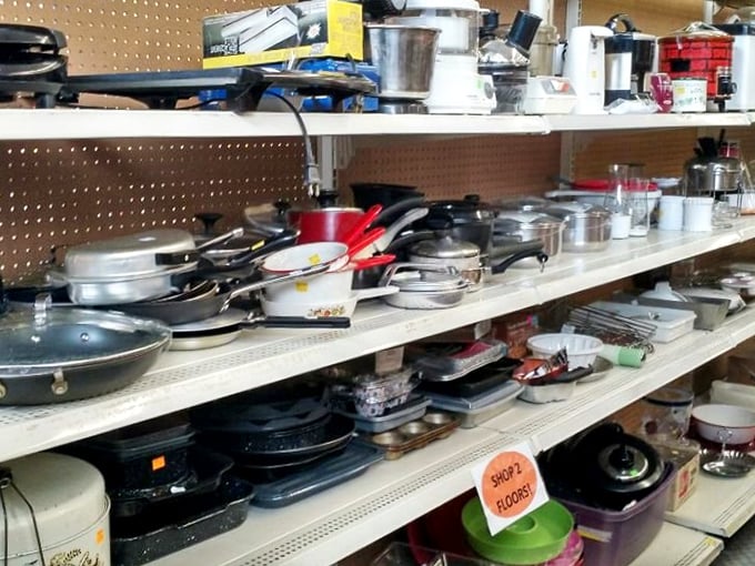 Kitchen implements galore! From barely-used wedding registry pans to well-seasoned cast iron that's outlived several marriages – cooking history on display.