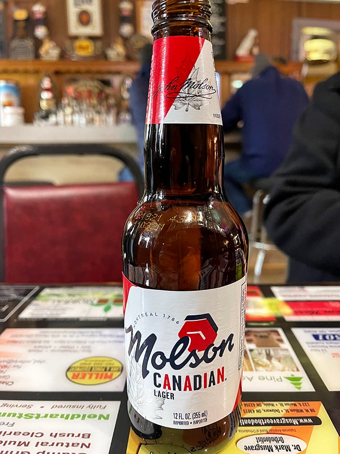 A cold Molson stands ready for duty – because nothing complements a legendary sandwich quite like a straightforward lager.