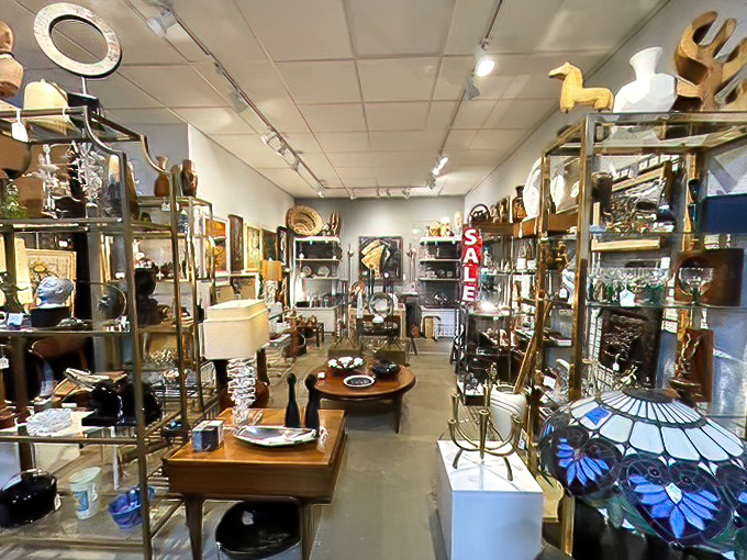 This isn't just a display—it's a masterclass in merchandising where brass, wood, and glass create a symphony of vintage sophistication.