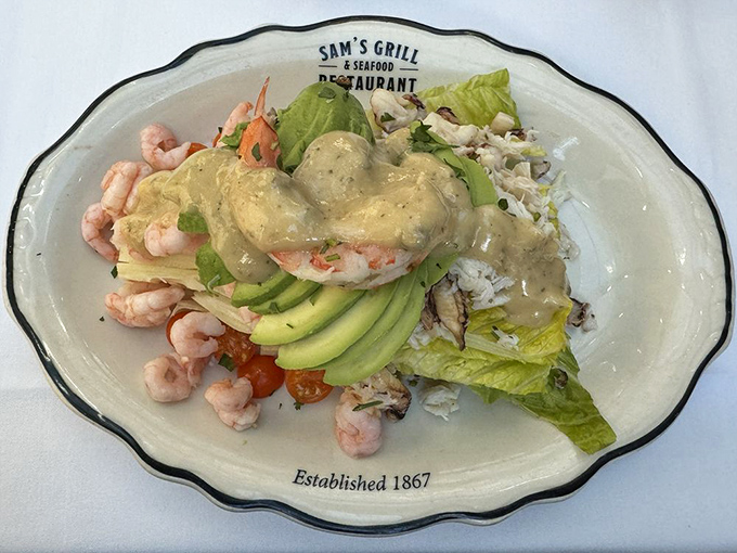 The Louie Salad—where lettuce becomes merely a stage for the real stars: plump shrimp and creamy dressing. Salad as indulgence, not punishment.