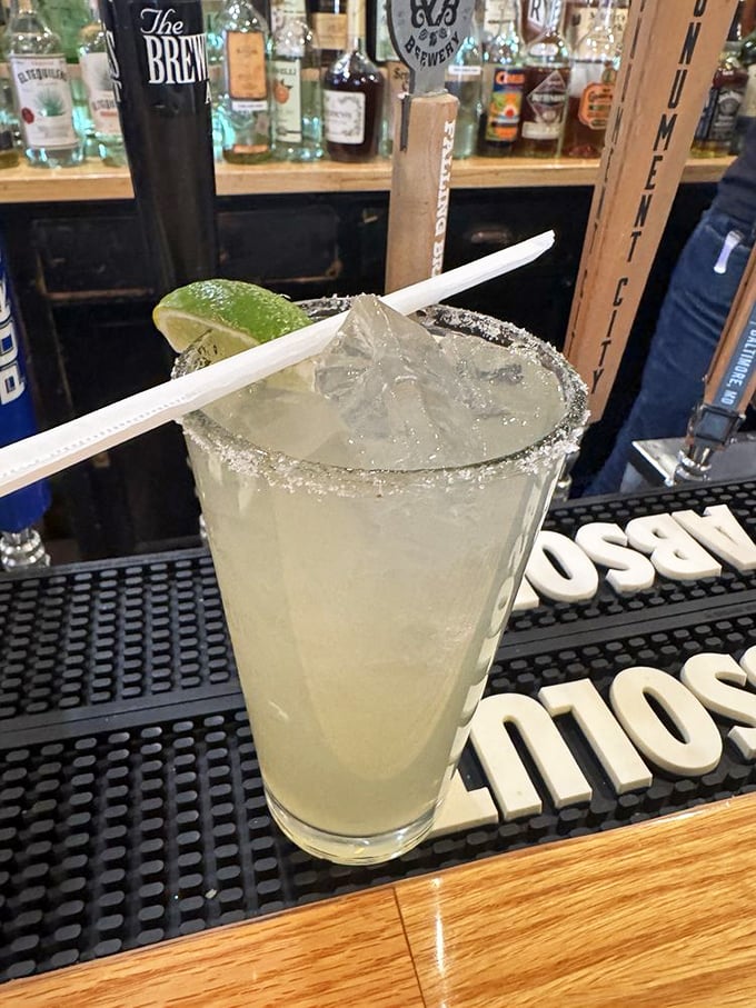 This margarita with its salt rim and lime wedge is the unsung hero of seafood pairings—cutting through richness one sip at a time.