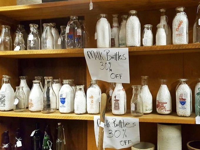 A dairy devotee's dream display—these vintage milk bottles recall mornings when delivery meant the clink of glass on porches.