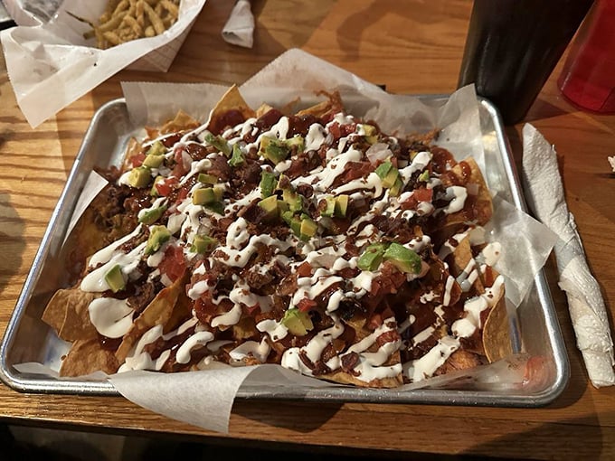 These loaded nachos aren't just a shareable appetizer—they're a topographical marvel of peaks, valleys, and delicious archaeological layers waiting to be excavated.