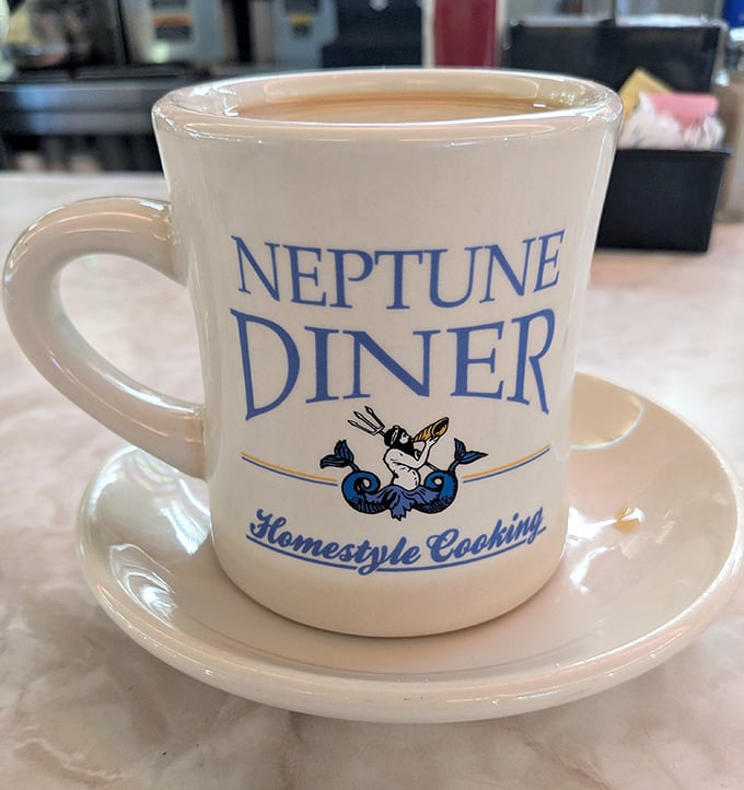 This isn't just a coffee mug—it's a vessel of liquid motivation adorned with Neptune's signature sea god, ready to jumpstart your morning.