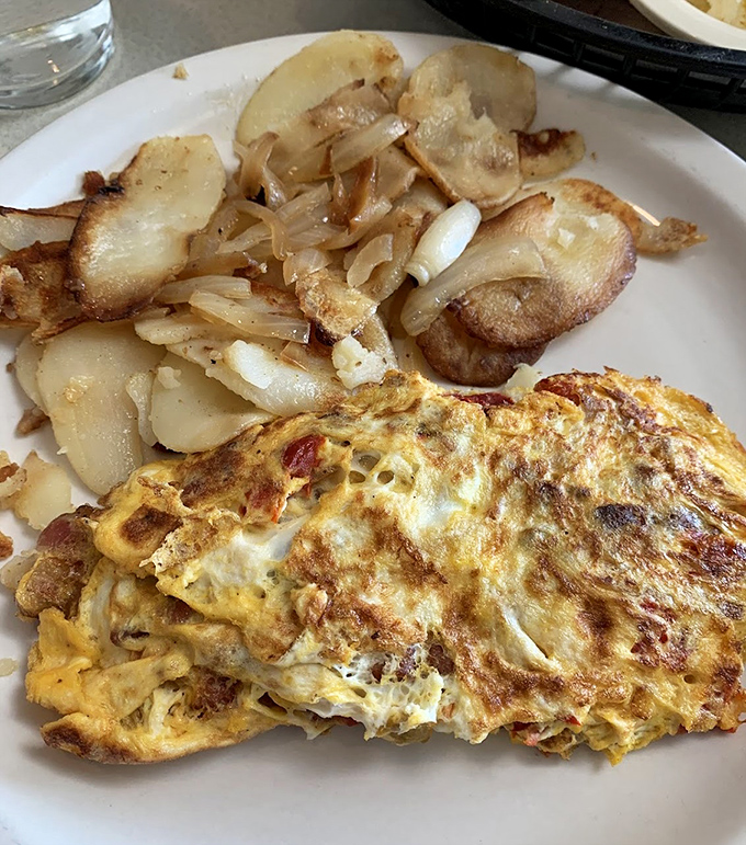 An omelet that's been to the gym—robust, well-formed, and filled with enough good stuff to keep you full until dinner.