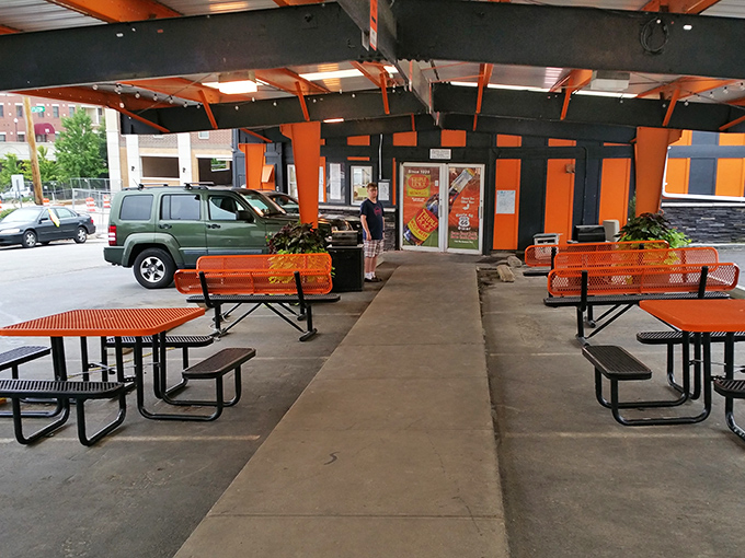 The outdoor seating area carries the Halloween theme right down to the orange benches—perfect for people-watching between bites.