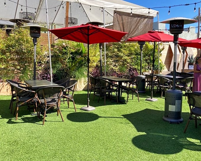 The patio's artificial turf adds a playful touch to an otherwise sophisticated outdoor space. Al fresco dining, Santa Monica style.