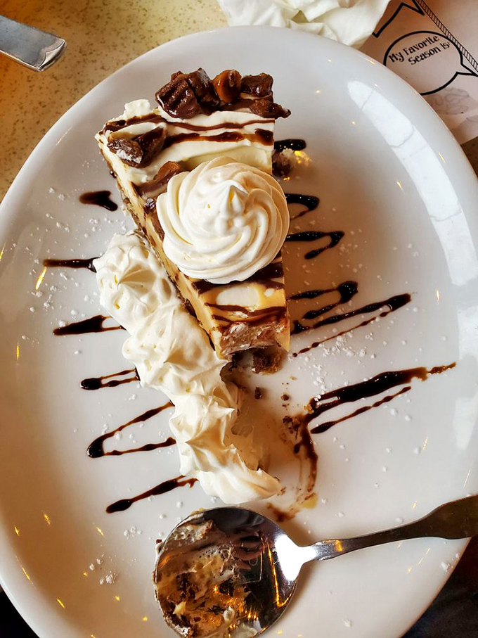 This slice of heaven isn't just dessert—it's the sweet finale to a seafood symphony, with whipped cream conducting the last delicious notes.