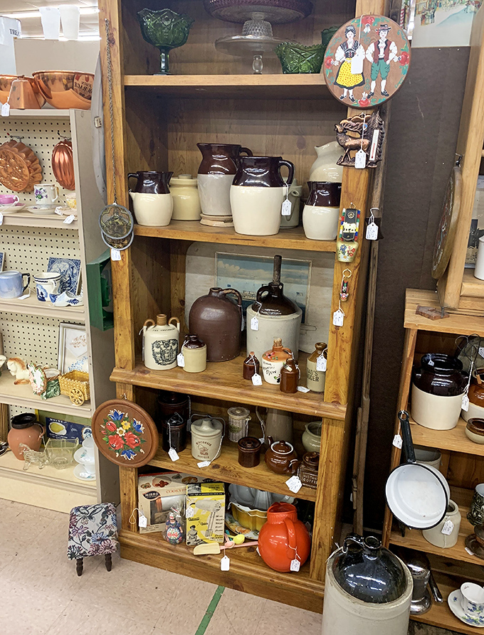 Stoneware crocks and jugs that once stored everything from moonshine to maple syrup—functional history with farmhouse charm.