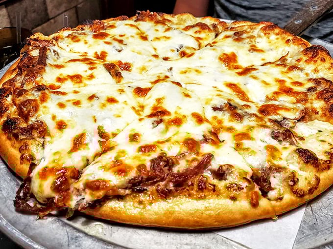 This pizza doesn't just have cheese—it has a magnificent golden blanket of it, bubbling with promise and melted perfection.