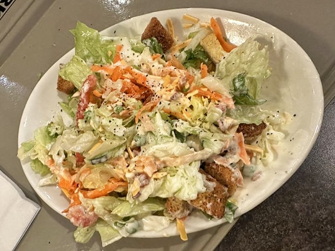 Fresh salad loaded with colorful toppings – because even carnivores need their vegetables to feel virtuous.