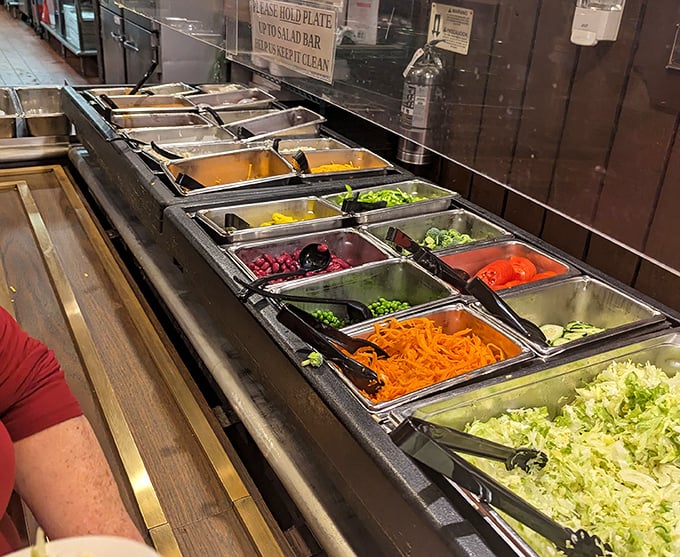The salad bar—that magnificent runway of freshness where vegetables strut their stuff and you become the designer of your pre-steak masterpiece.