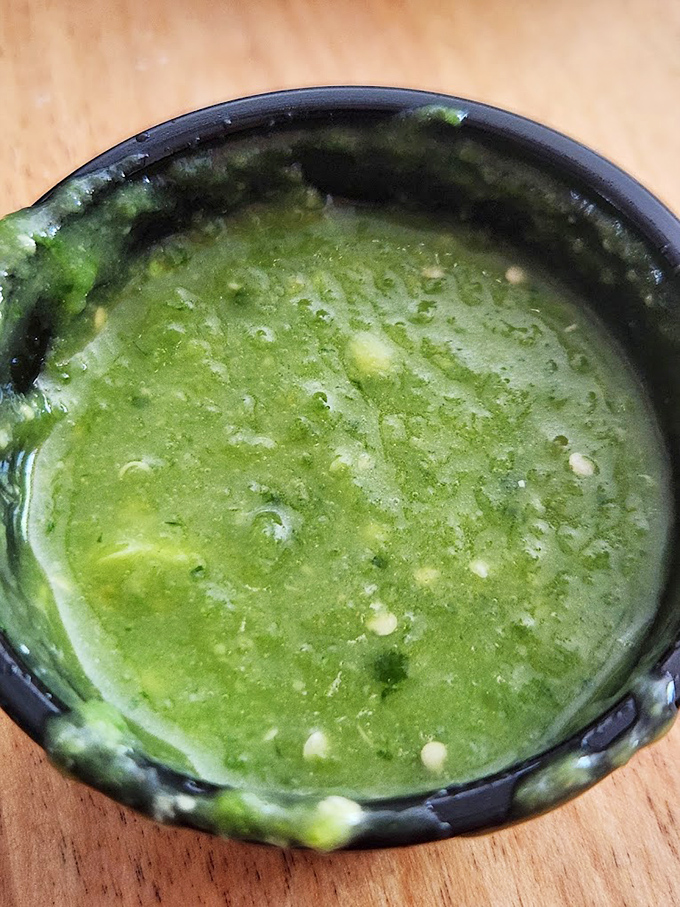 This salsa verde isn't just green—it's a verdant pool of possibility. Dip with caution; your taste buds might never want to return.