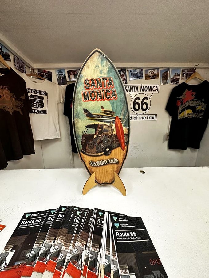 The Santa Monica surfboard display marks the highway's end—where weary travelers finally reached the Pacific and could surf away their road fatigue.