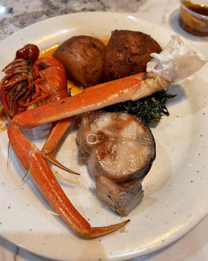 Snow crab legs and fish steaks—the crown jewels of any seafood buffet. This plate is what seafood dreams are made of.