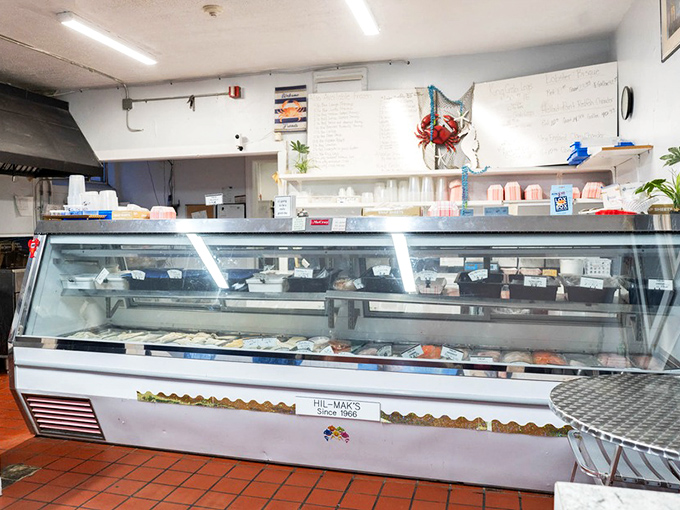 Behind this glass lies the day's catch—a seafood showcase that makes choosing your dinner both the hardest and most delightful decision of your day.