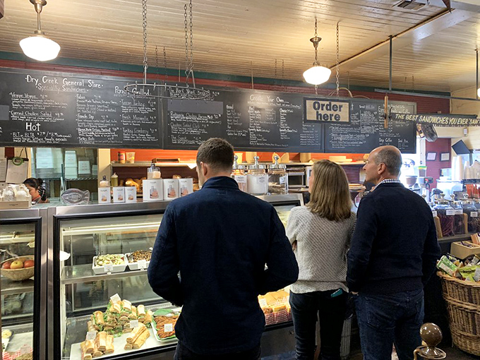 The moment of anticipation—customers contemplating life's most important decision: which legendary sandwich will be theirs today?