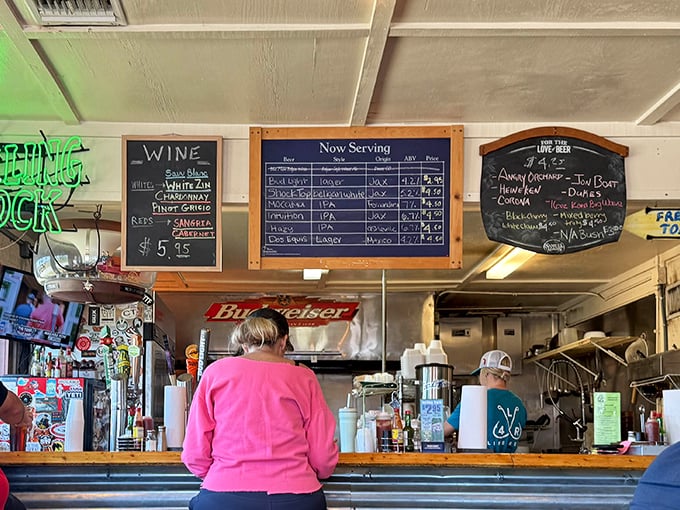 The service counter where culinary dreams come true. Note the rope-wrapped column—because even the support beams dress for the nautical theme.