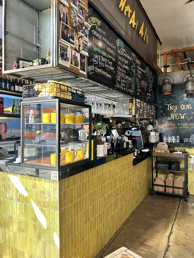 The yellow-tiled counter and chalkboard menu wall create the perfect backdrop for coffee crafting and breakfast banter.