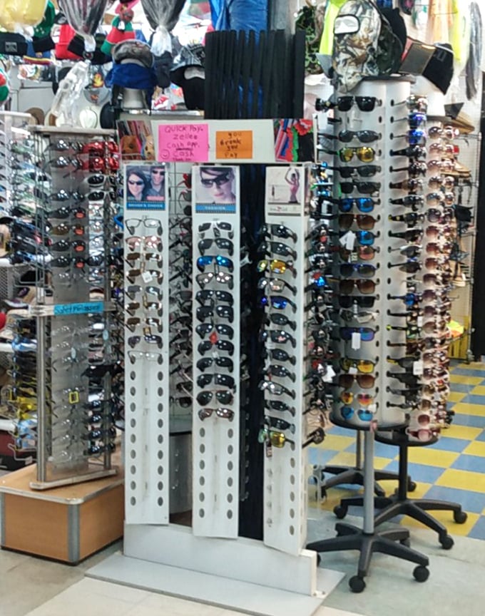 Sunglasses as far as the eye can see—which, ironically, you might need help seeing without the right pair. Fashion and function collide in this spinning display of possibilities.