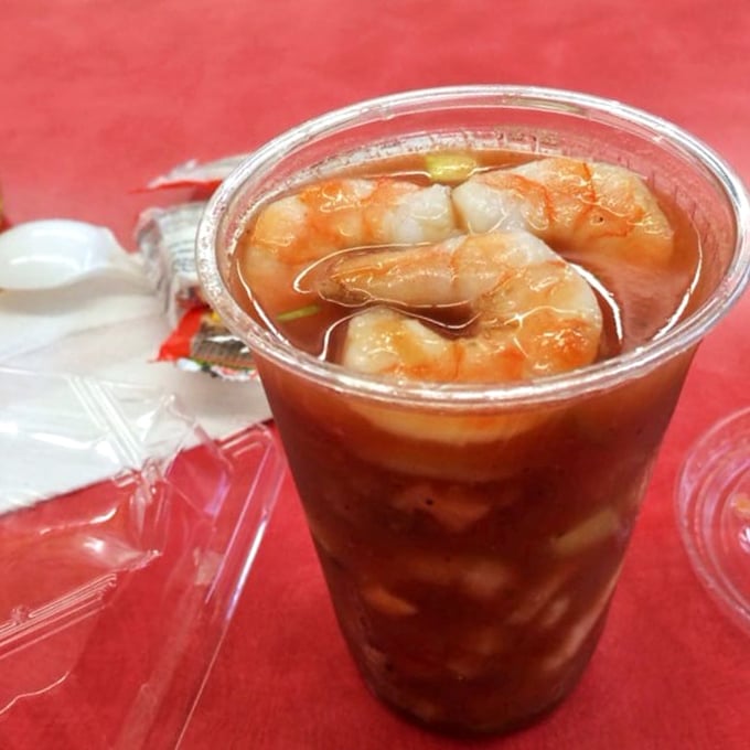 Plump shrimp swimming in a tangy marinade – proof that good things come in transparent plastic cups when you're at Basa Seafood Express.