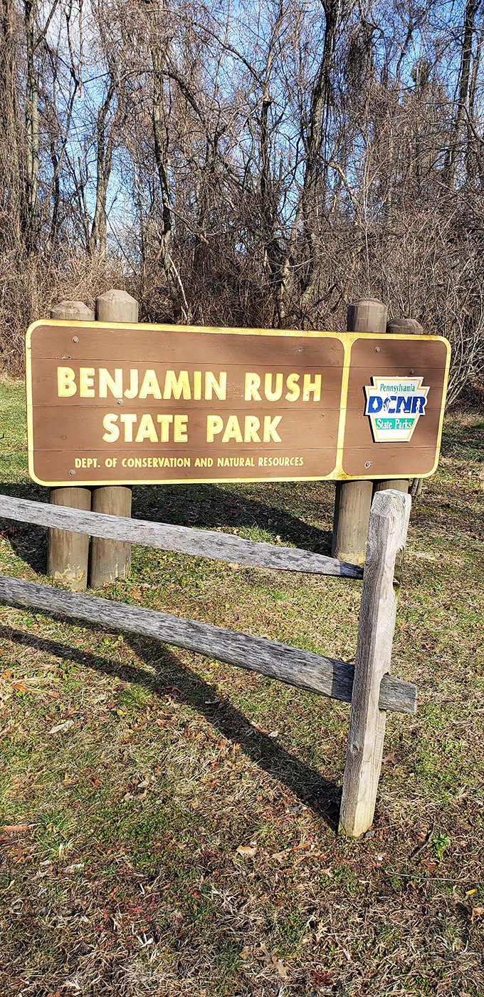 The official welcome sign stands sentinel through changing seasons, a constant reminder of Philadelphia's commitment to green spaces.