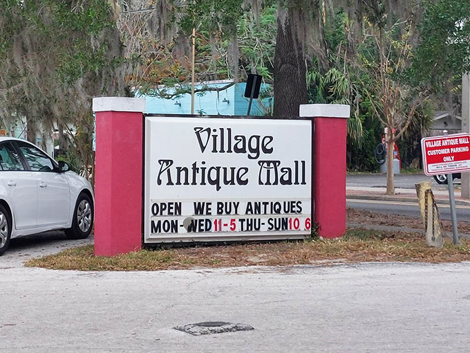 The sign says they buy antiques too—creating a circular economy of nostalgia that keeps Mount Dora's vintage heart beating.