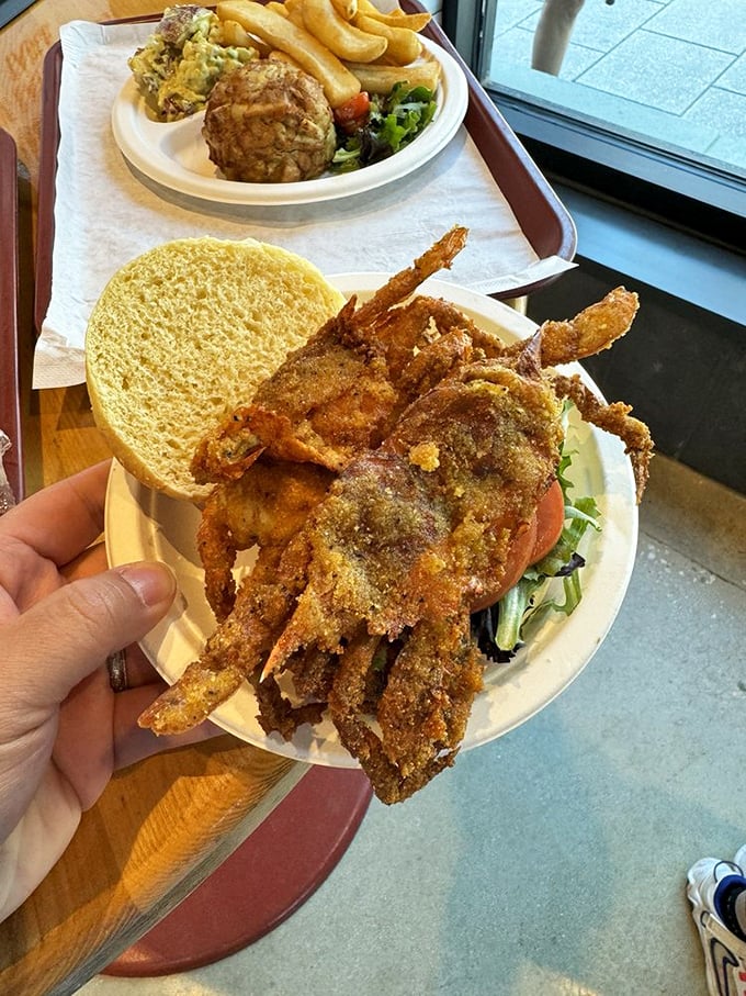 The soft shell crab sandwich—legs akimbo, proudly hanging over the bread. It's the sandwich that stares back at you, daring you to take that first delicious bite.