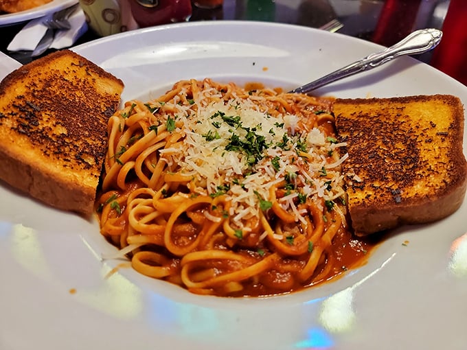 Spaghetti with garlic toast—comfort food that wraps around you like your favorite sweater on the first chilly day of fall.