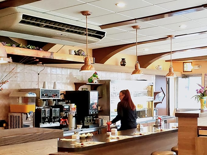 The counter – where solo diners find community, regulars get their "usual," and the coffee never reaches the bottom of the cup.